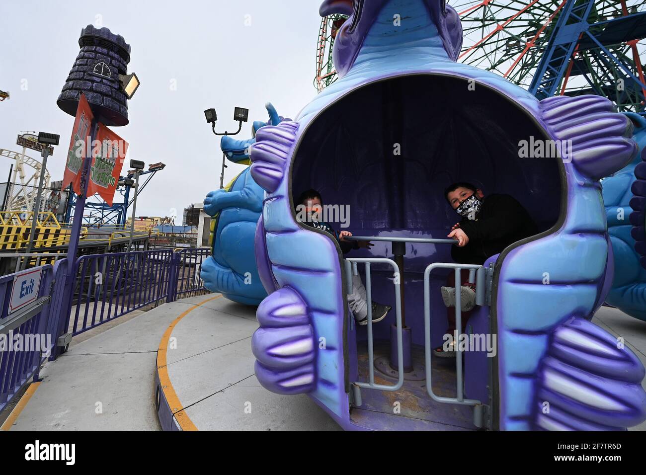 New York, USA. 09th Apr, 2021. Kids spin around on the Dizzy Dragon ...