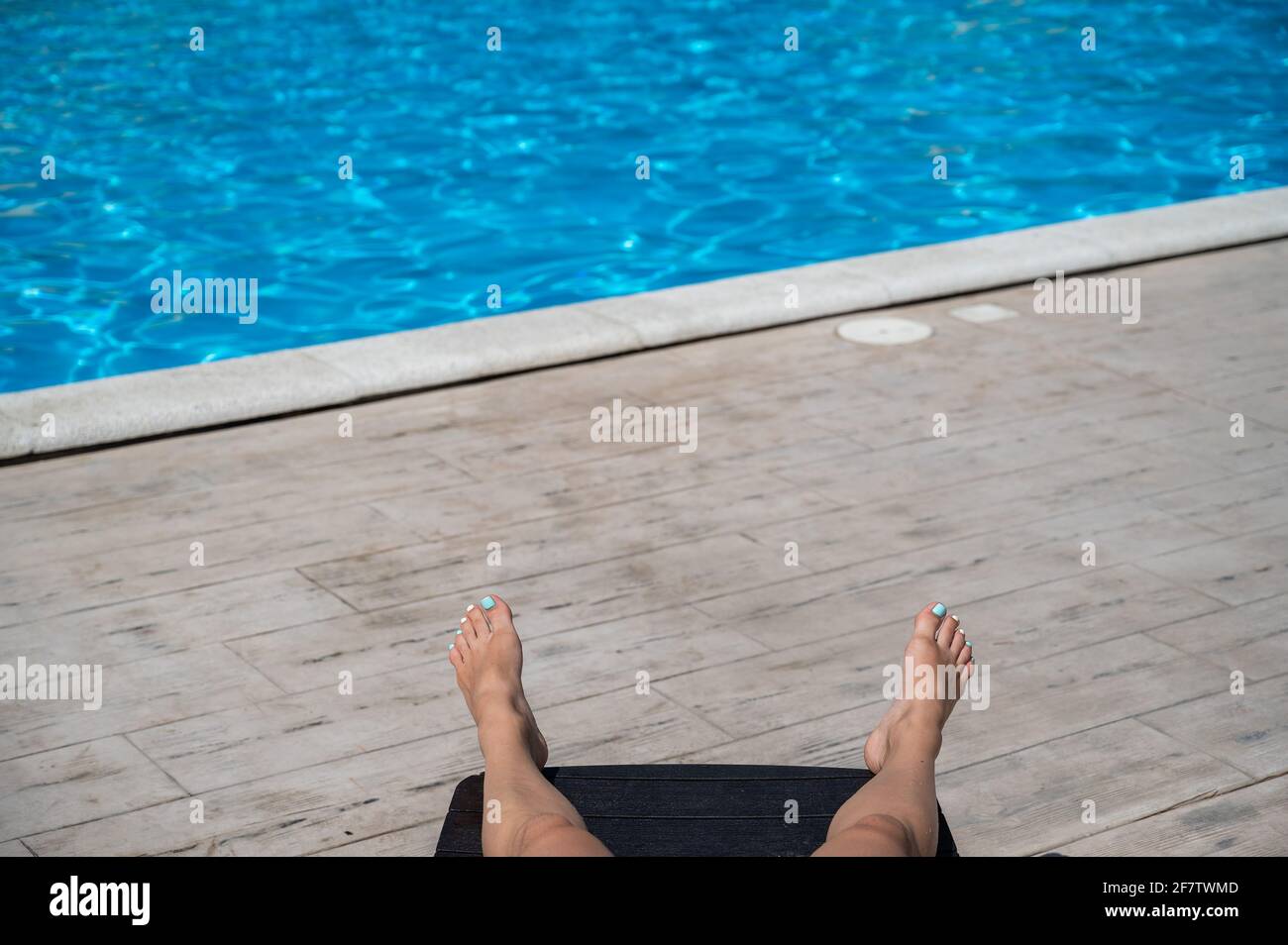 Feet legs on swimming pool hi-res stock photography and images - Alamy