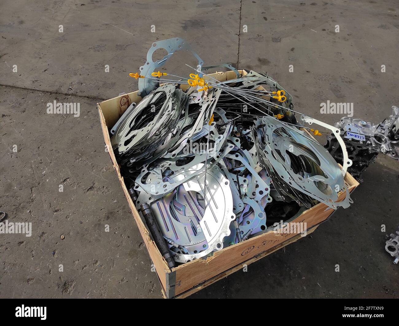Box full of spare parts for cars Stock Photo - Alamy