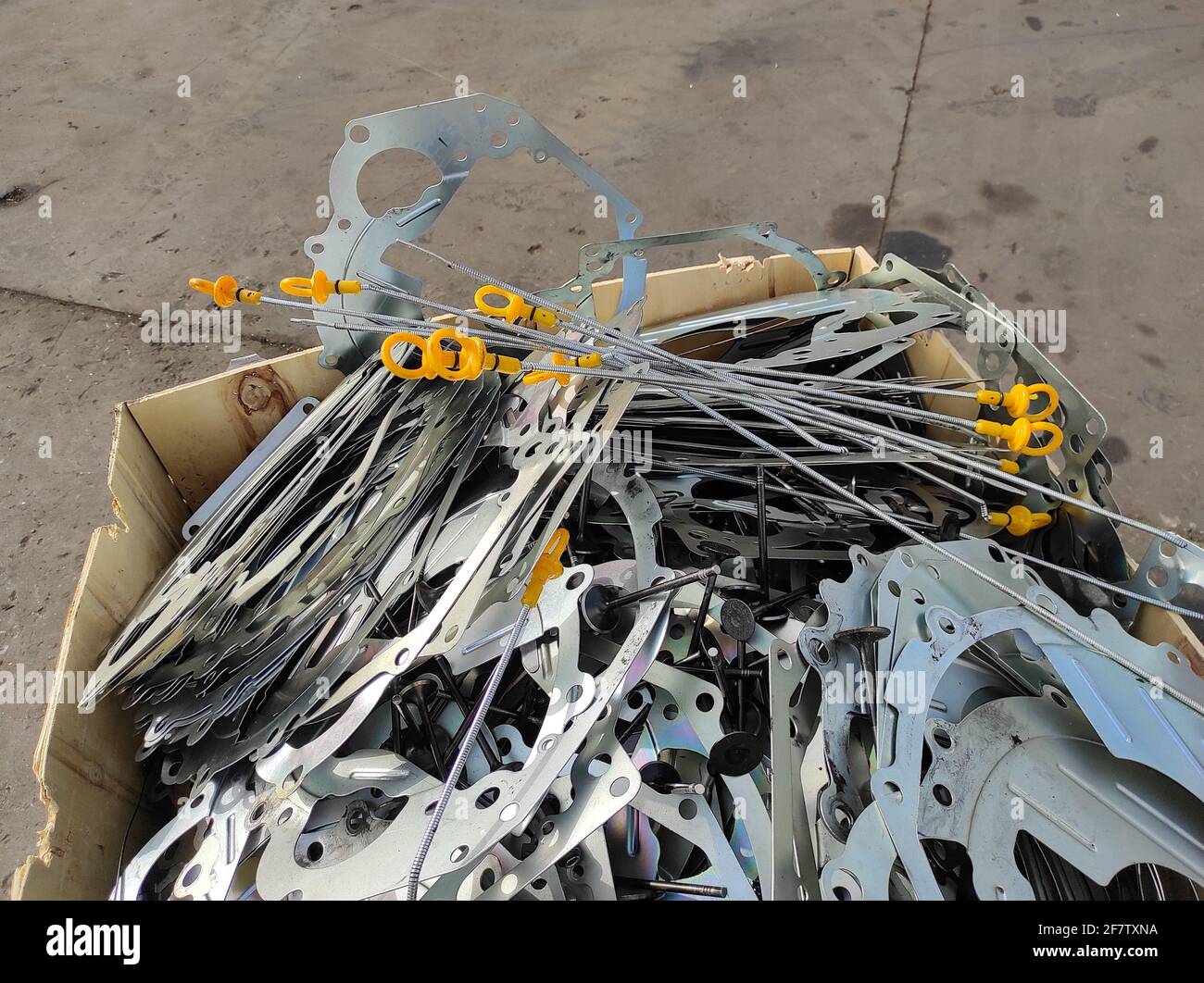 Box full of spare parts for cars Stock Photo - Alamy