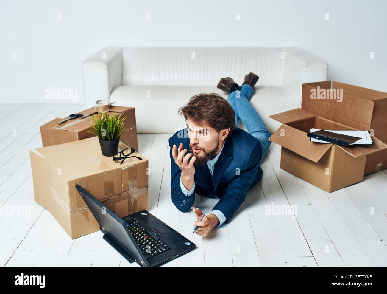 Man in suit with boxes moving laptop lifestyle Professional Stock Photo ...