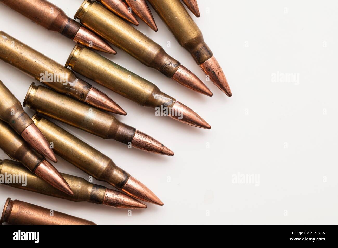 A group of bullet ammunition shells on a white background Stock Photo ...