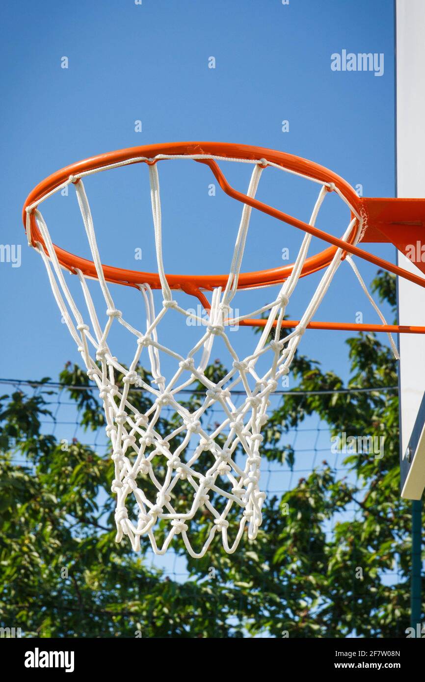 Basketball board with hoop on sky background. Sport and recreation time ...
