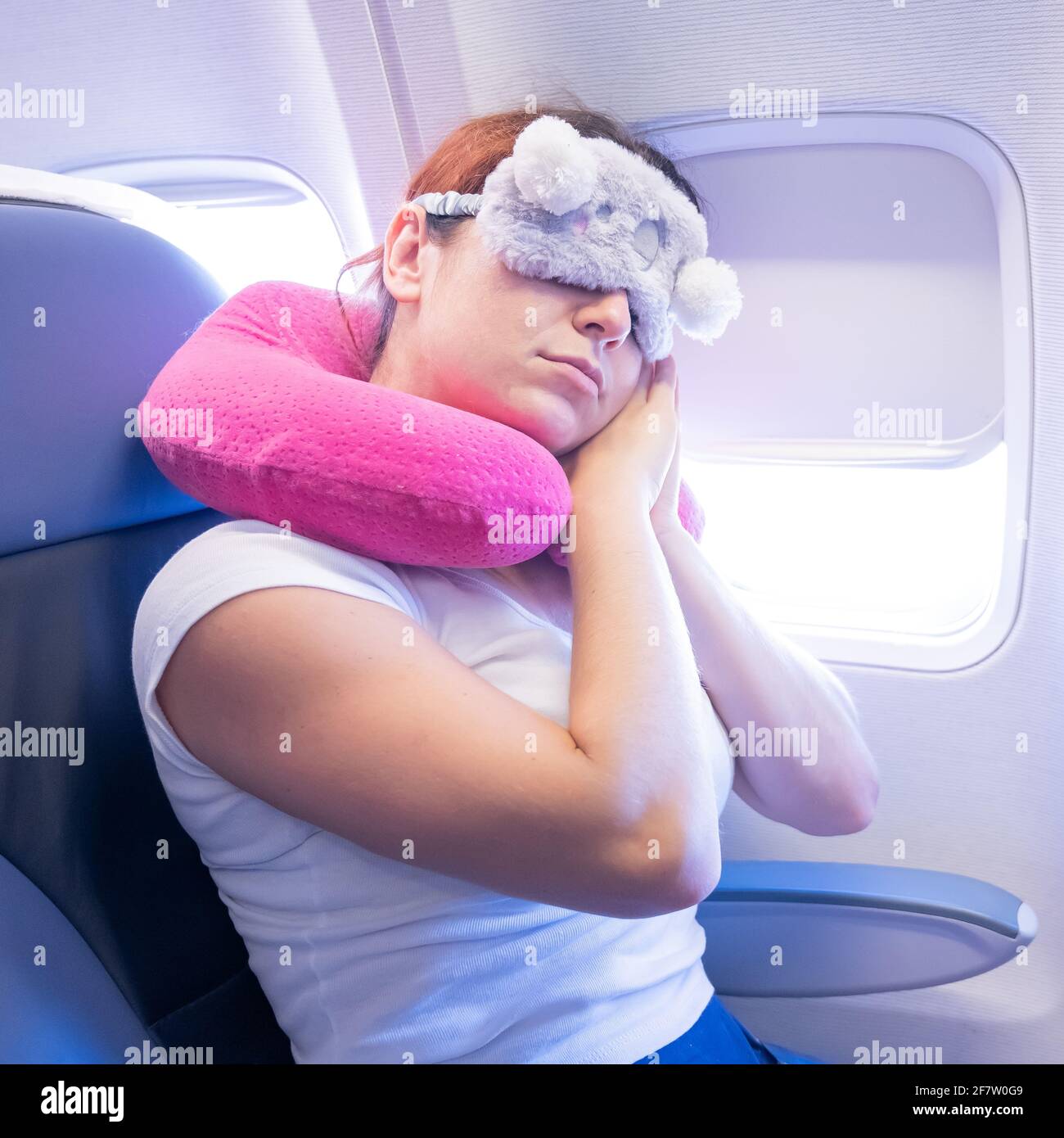Woman sleeping on airplane mask hi-res stock photography and images - Alamy