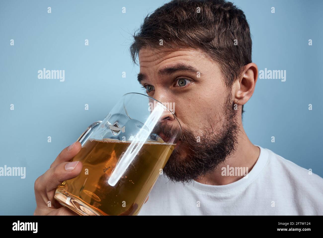 Cheerful drunk man beer mug diet food fun blue background Stock Photo ...
