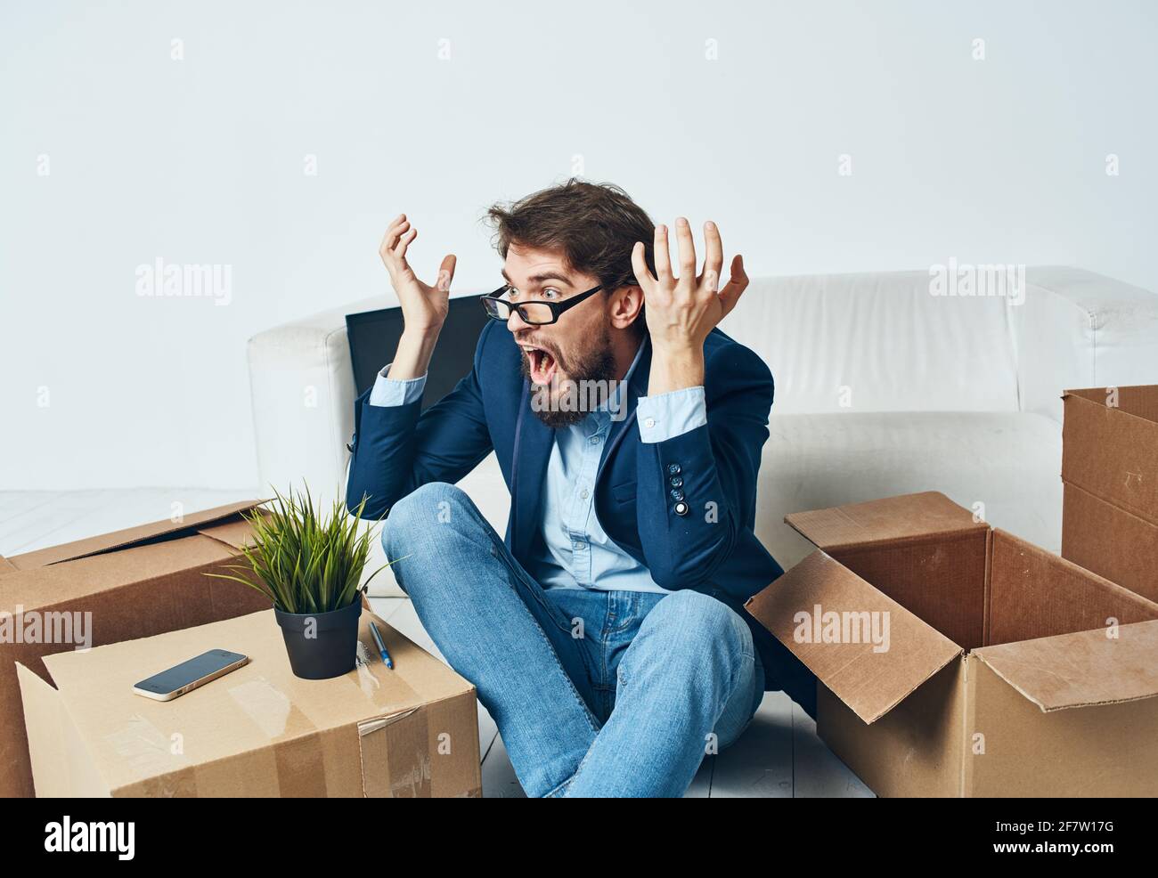 Business man emotion boxes with office official things Stock Photo - Alamy