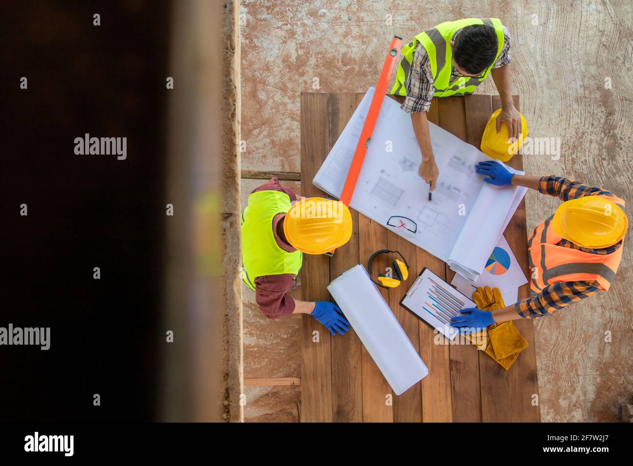 Top view of Team work construction engineer and architects working ...