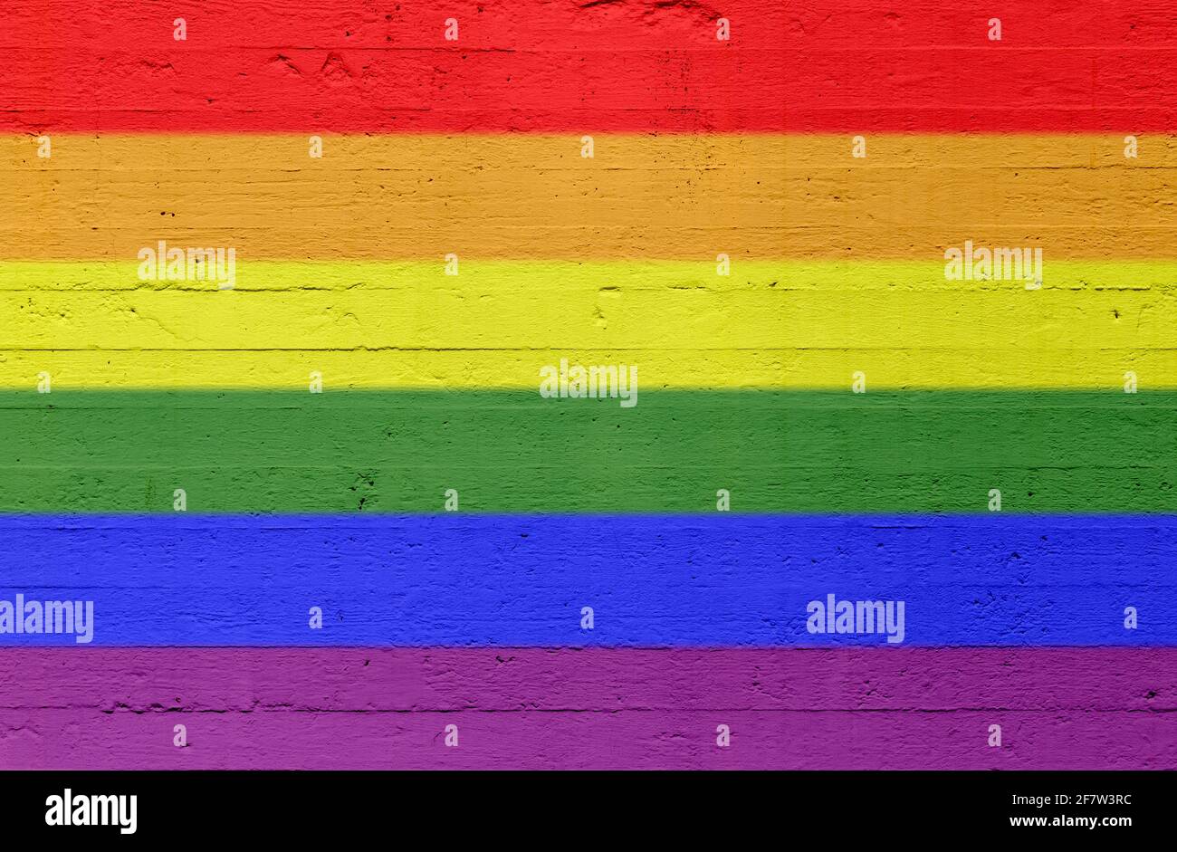 Rainbow colored LGBT pride flag painted on a concrete wall. High ...