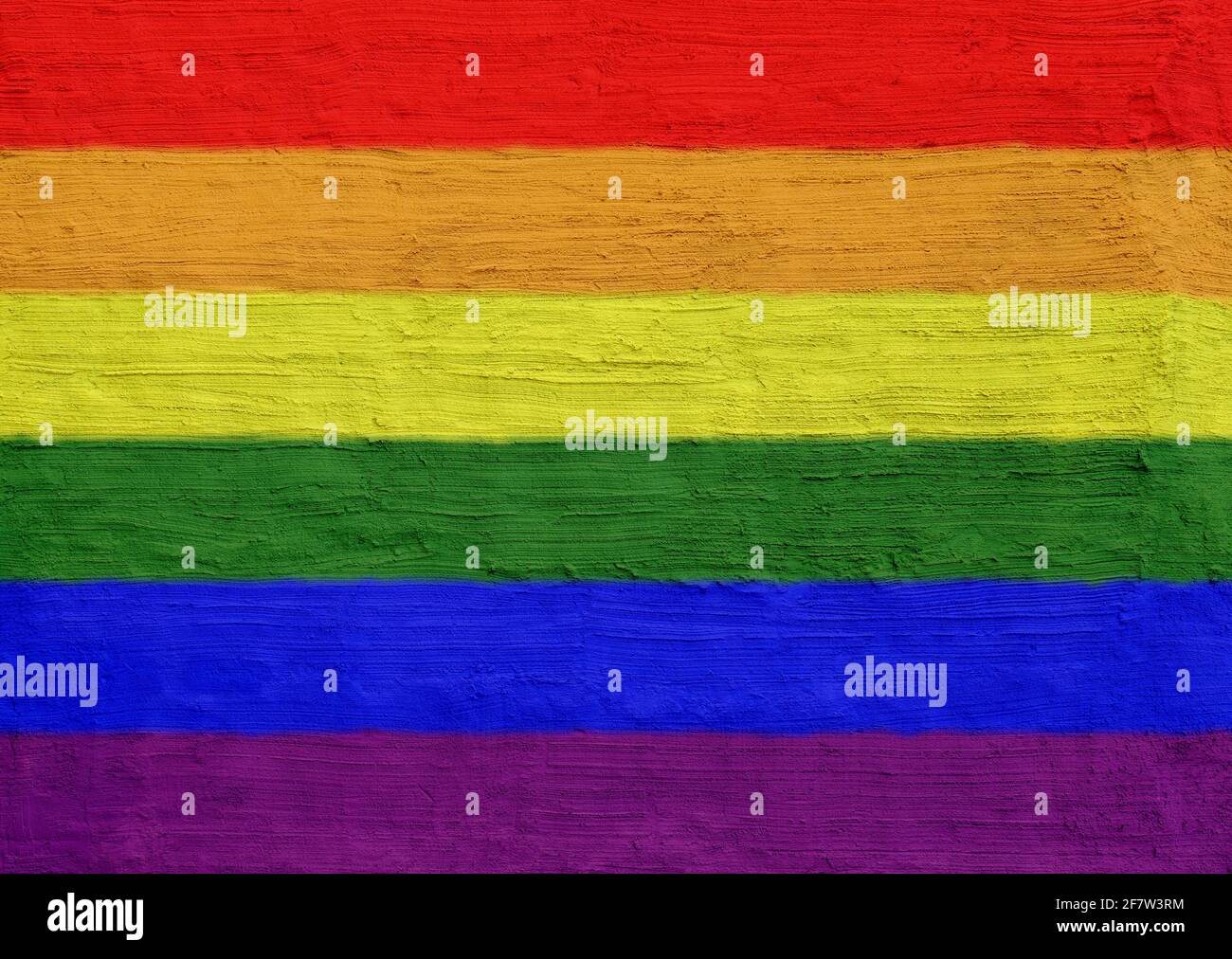 Rainbow colored LGBT pride flag painted on a plastered & rough wall ...