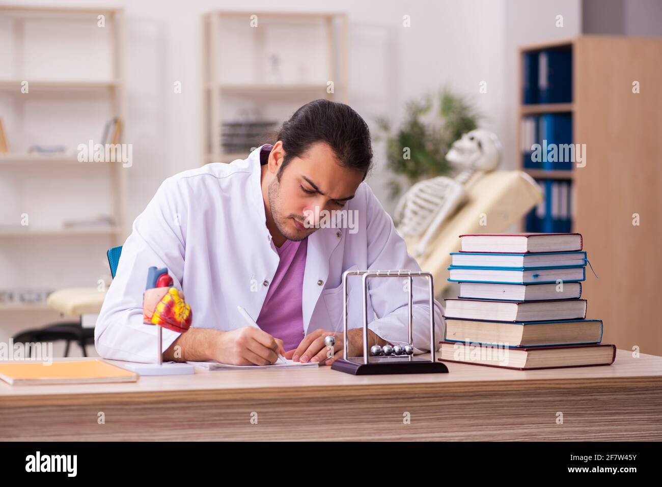 Young doctor student sitting in the classroom Stock Photo - Alamy