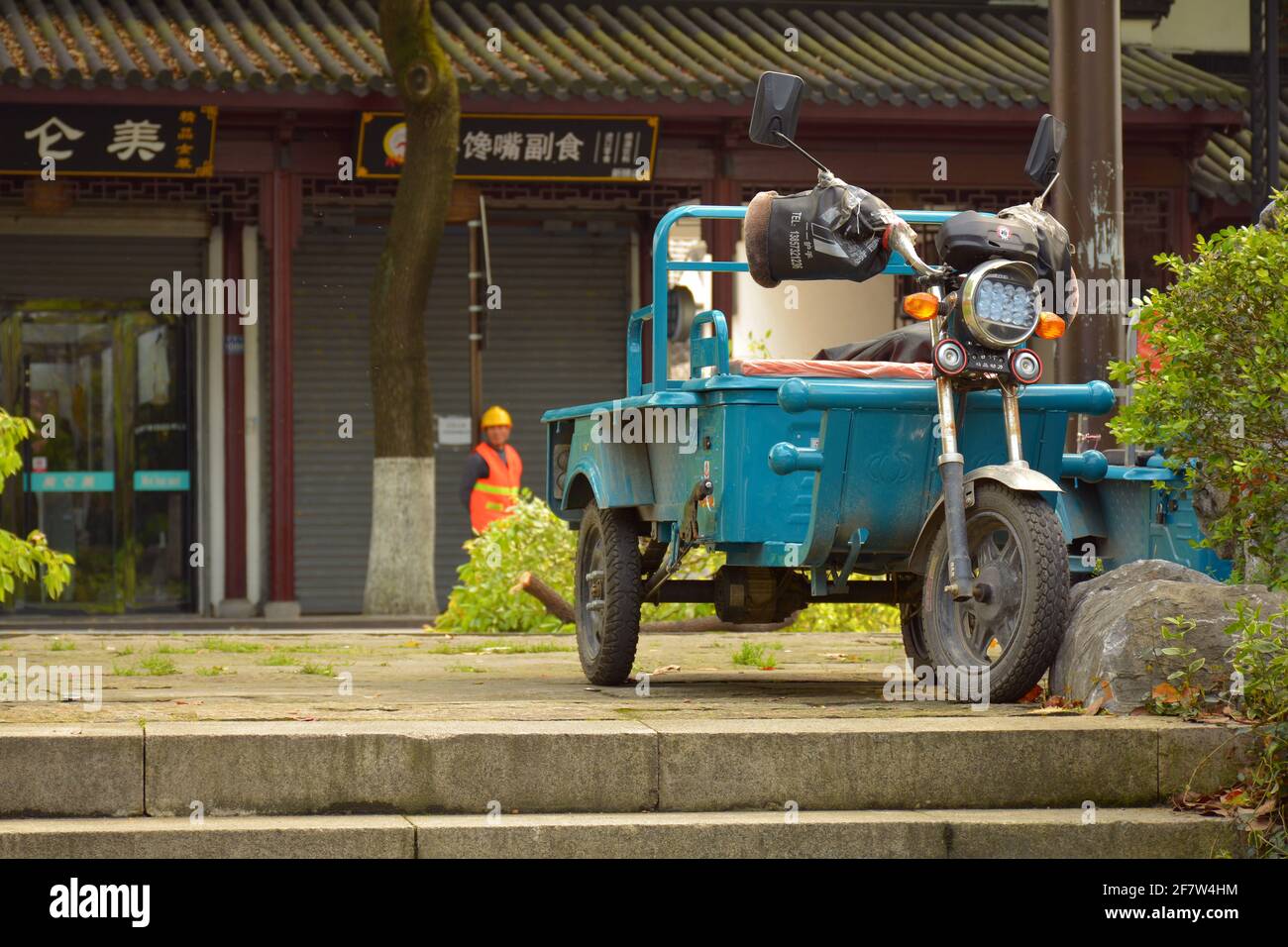 Small 3 wheel utility vehicle on a Chinese street. Used for a variety ...