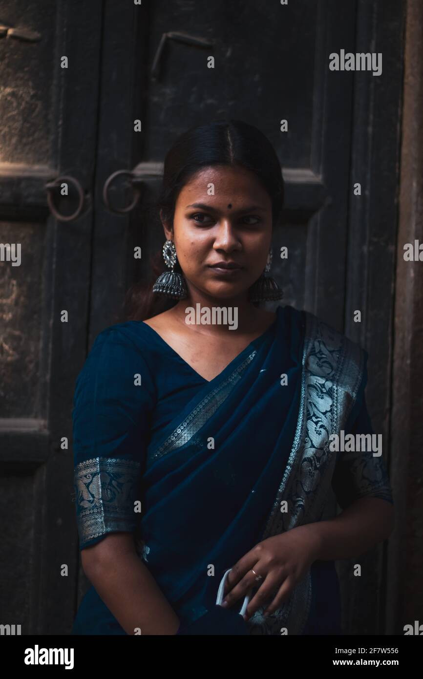 Vertical shot of an Indian lady dressed in blue traditional Indian ...