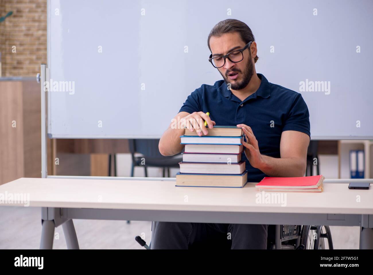 Young handicapped student in the classroom Stock Photo - Alamy