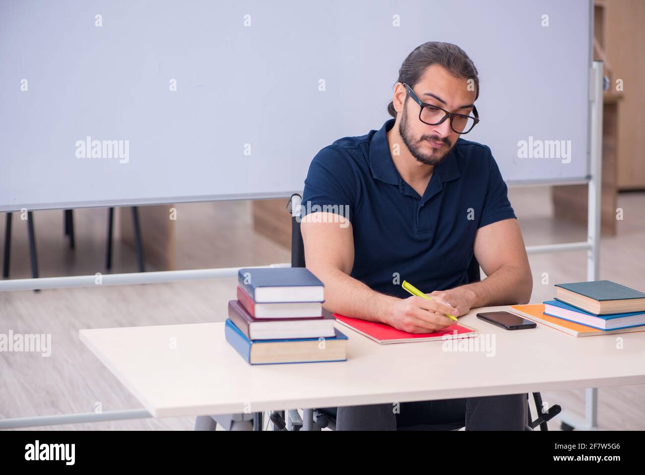 Young handicapped student in the classroom Stock Photo - Alamy