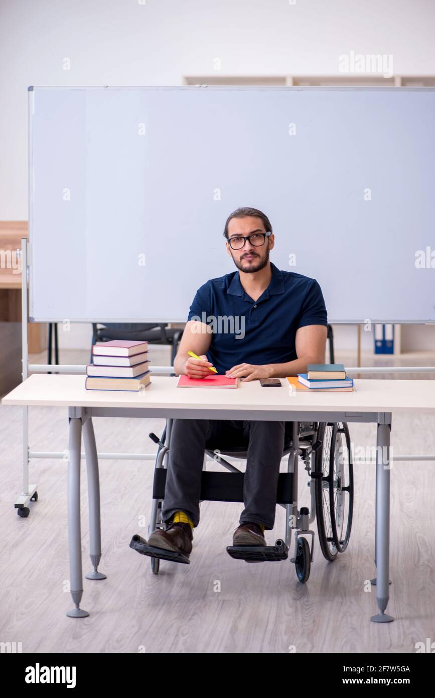 Young handicapped student in the classroom Stock Photo - Alamy