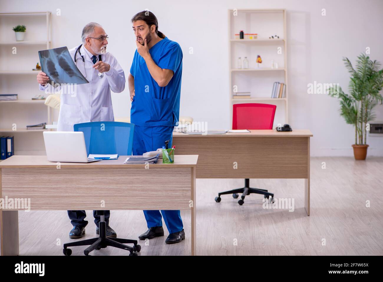 Two doctors working in the hospital Stock Photo - Alamy