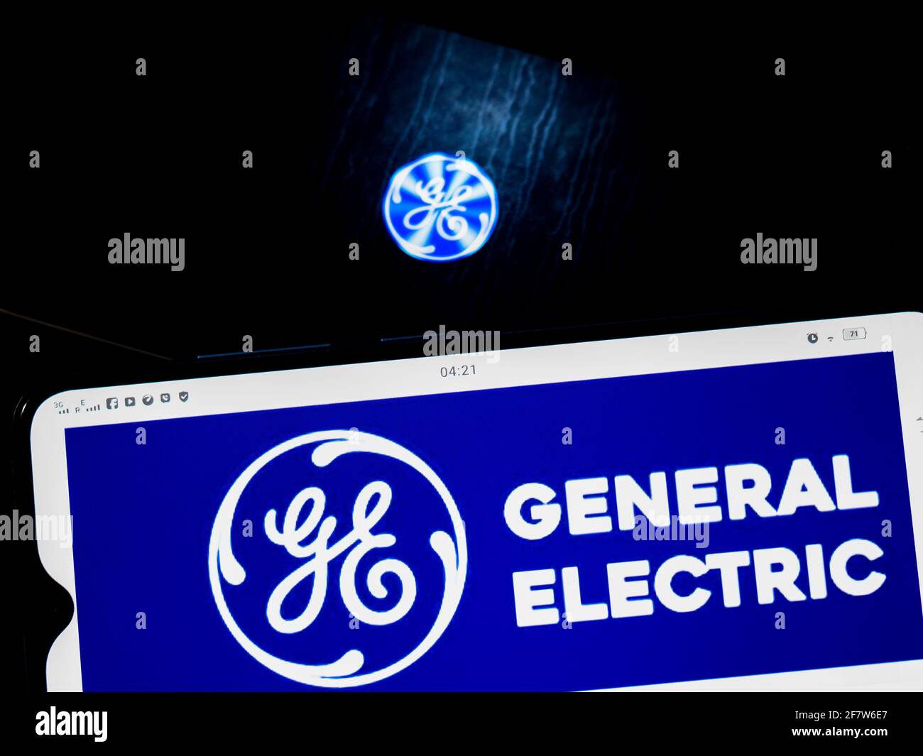 In this photo illustration General Electric Company logo seen displayed ...