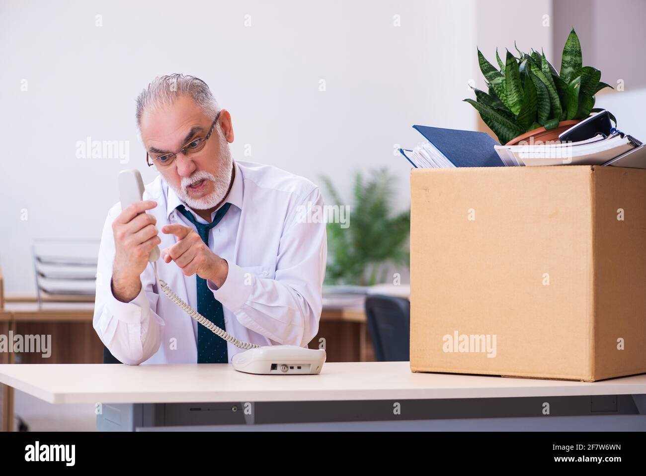 Old employee being fired from his work Stock Photo - Alamy