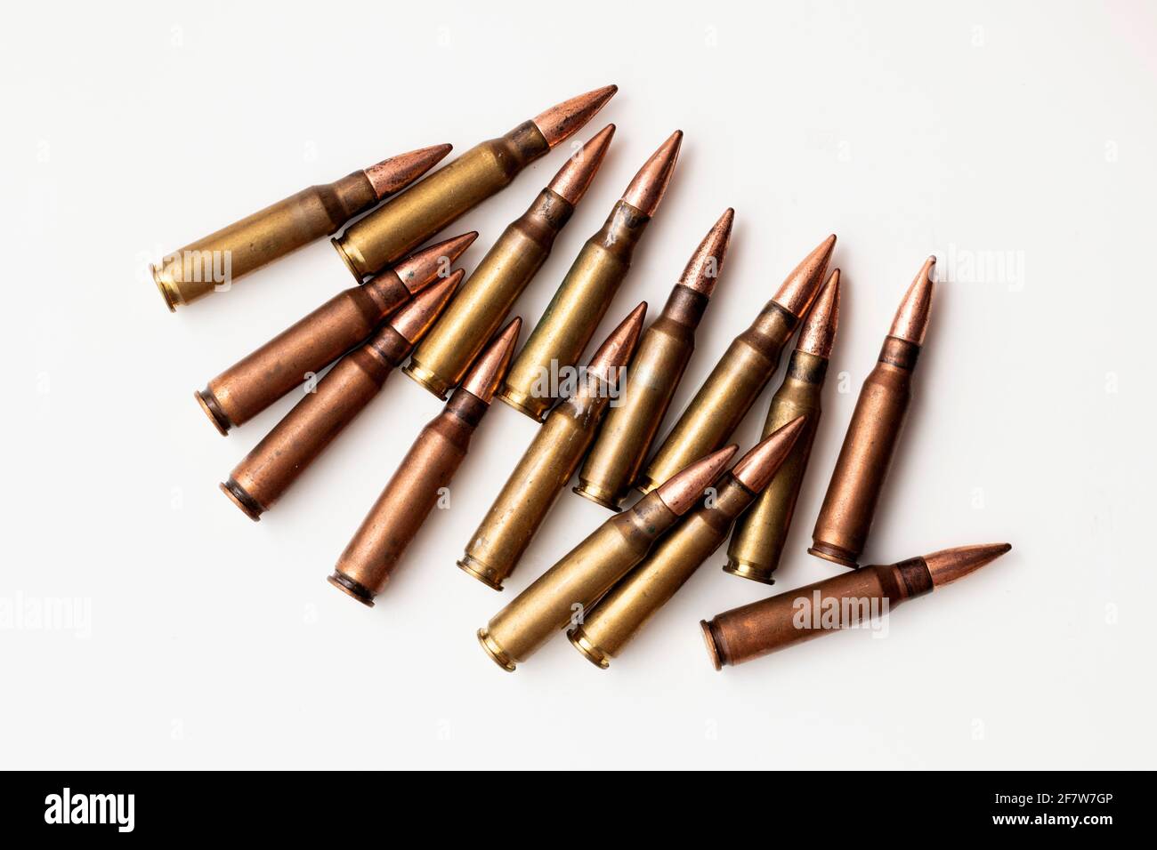 A group of bullet ammunition shells on a white background Stock Photo ...