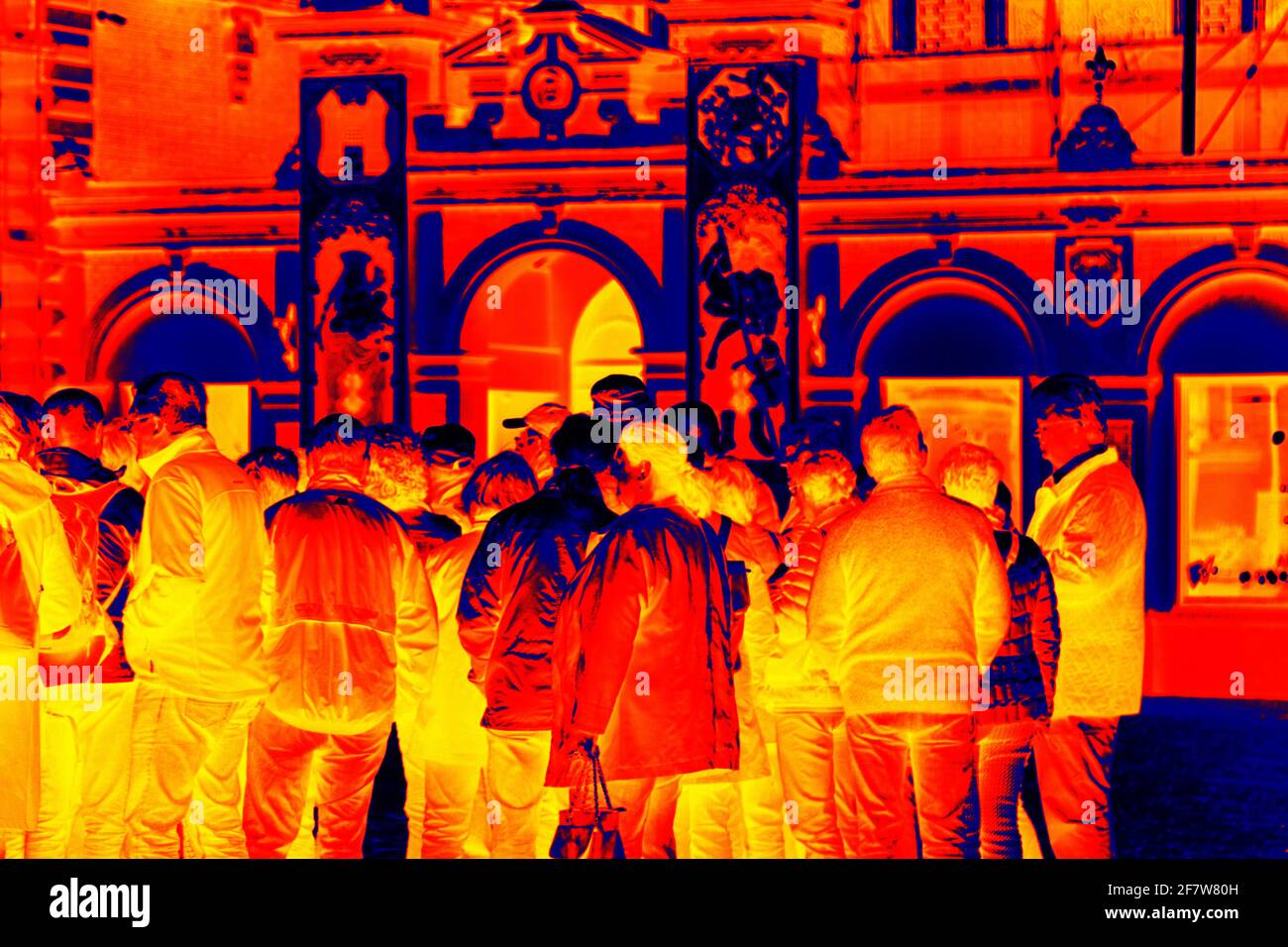 A crowd of men at the entrance to the pub, Scanning the people's body ...