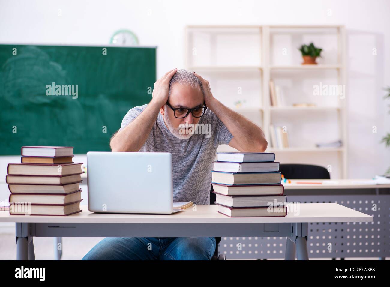 Senior male student in tele-education concept Stock Photo - Alamy