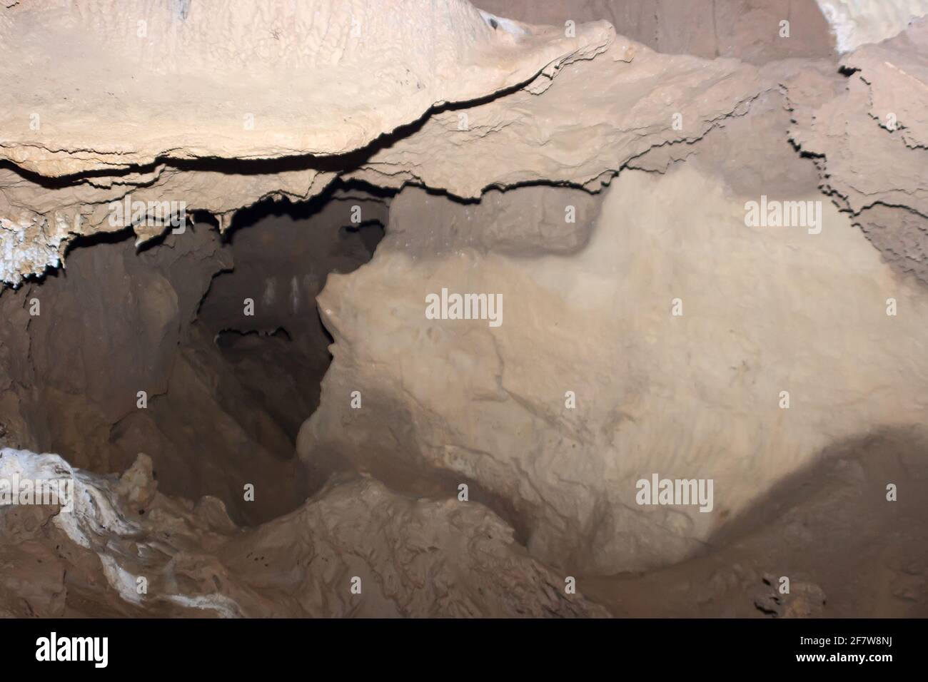Speleology. Old cave washed by an underground river in the mountain ...