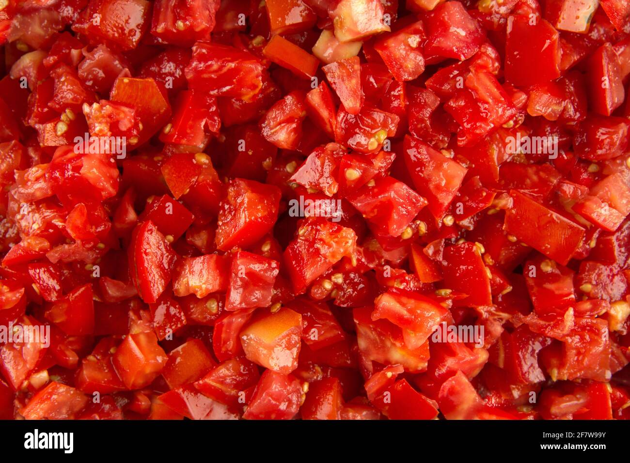 Closeup on red chopped tomato texture background Stock Photo - Alamy