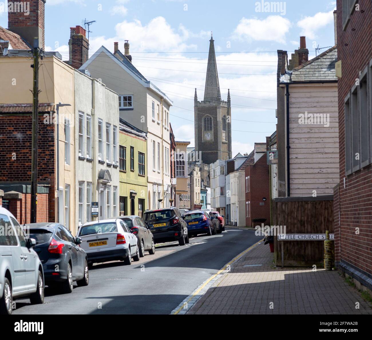 Church of Saint Nicholas tower rising above historic buildings, Harwich ...