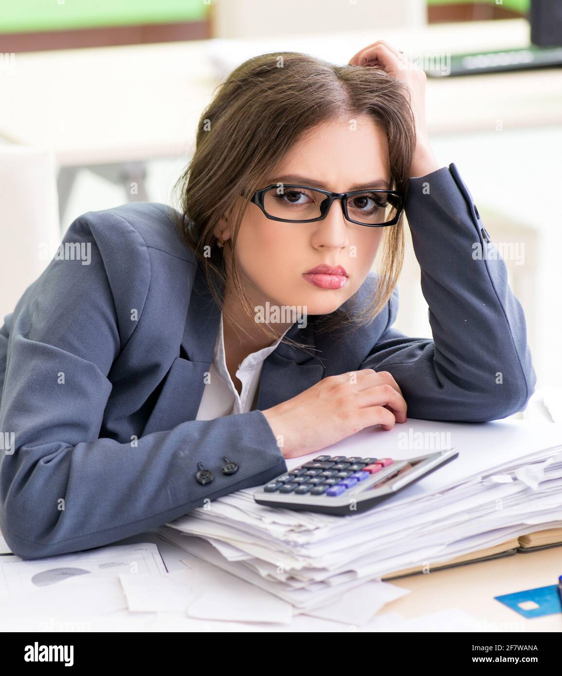 The female financial manager working in the office Stock Photo - Alamy