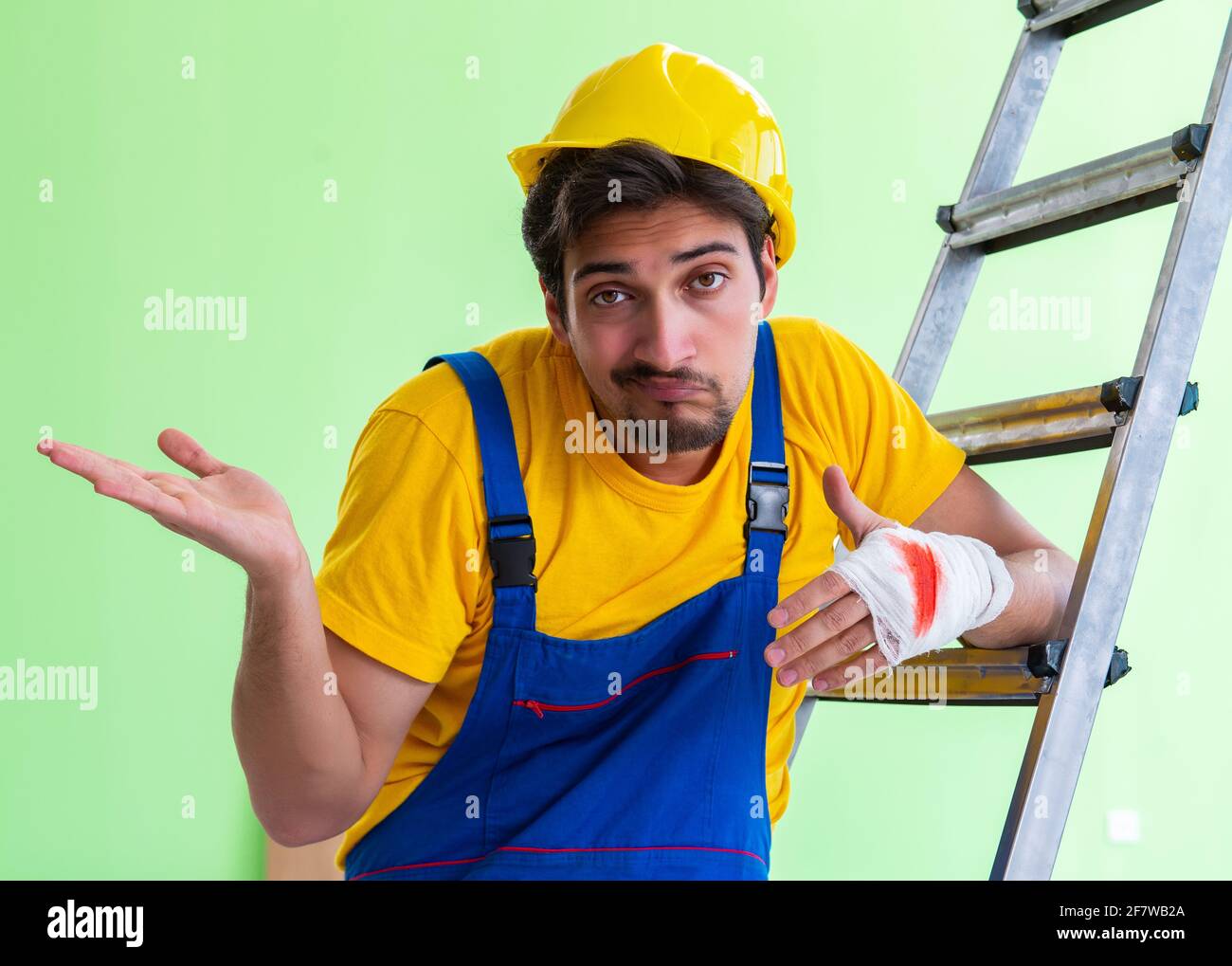 The injured worker at the work site Stock Photo - Alamy