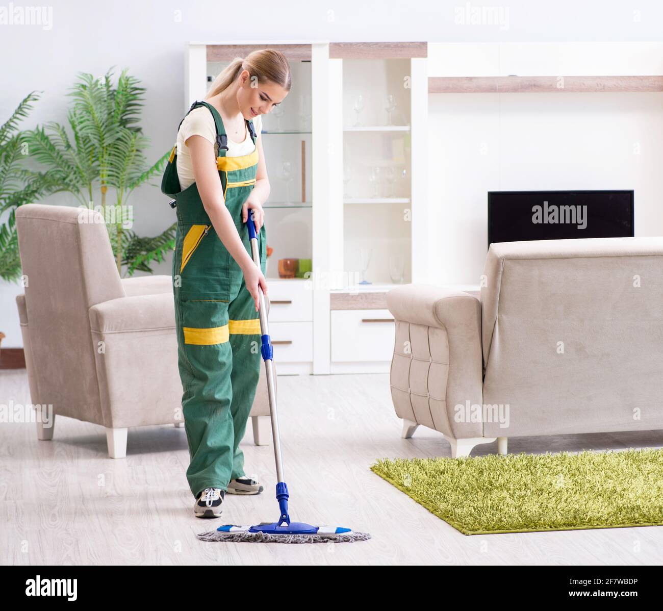 The woman female cleaner cleaning floor Stock Photo - Alamy