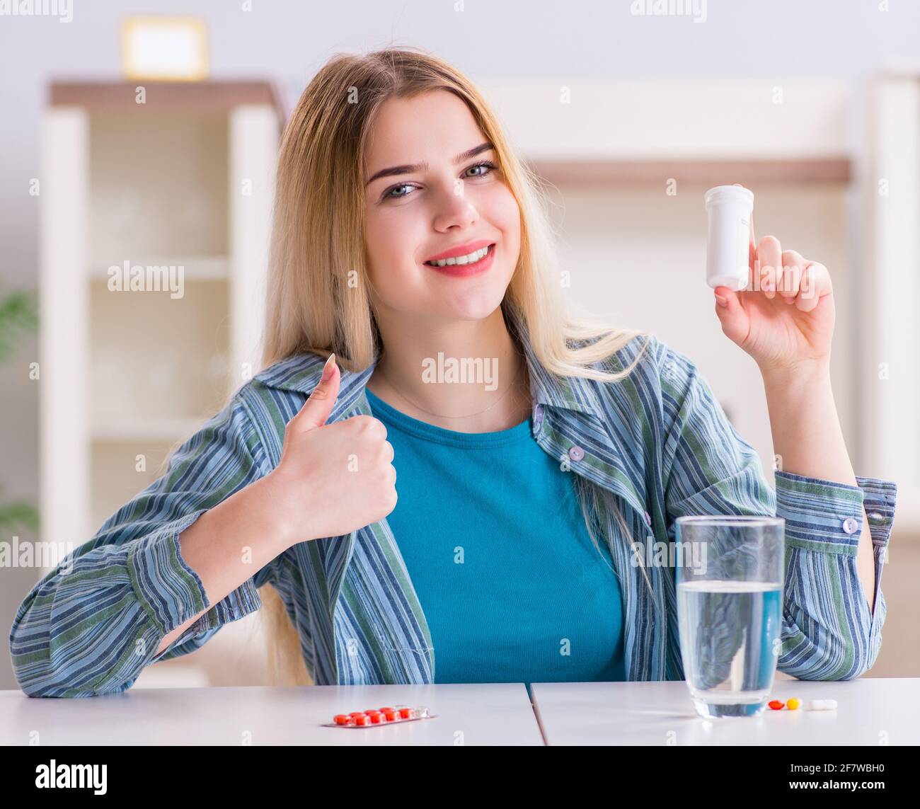 Thumbs up woman pills hi-res stock photography and images - Alamy