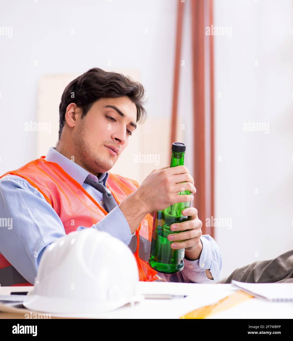 The drunk engineer working in the workshop Stock Photo - Alamy