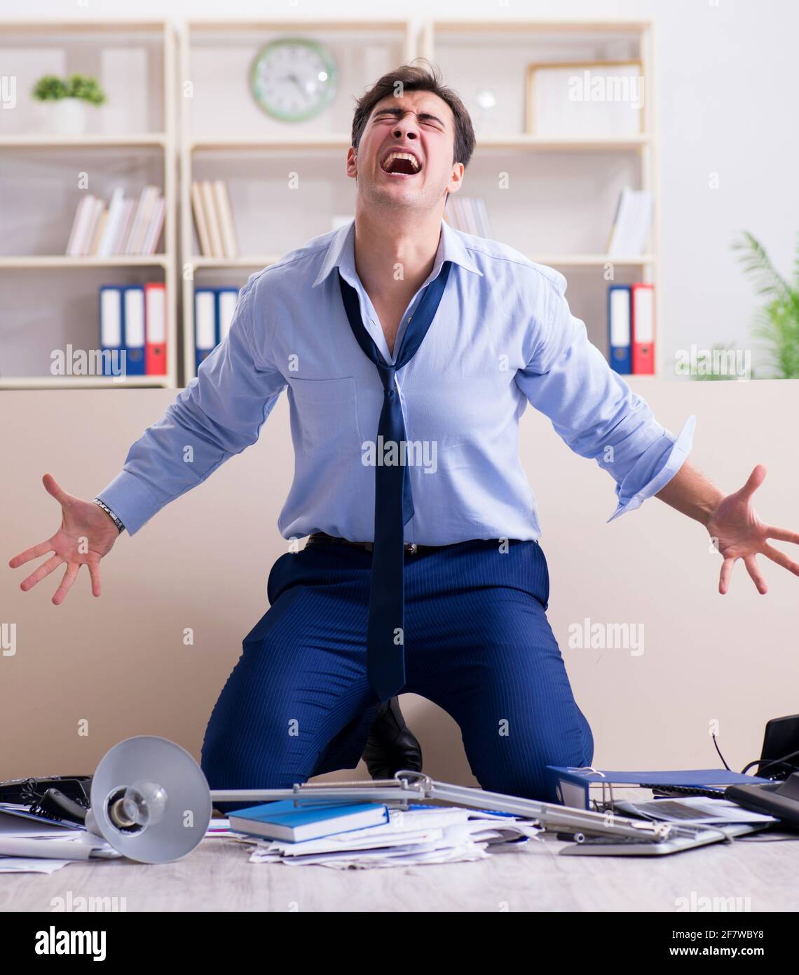 The angry businessman frustrated with too much work Stock Photo - Alamy