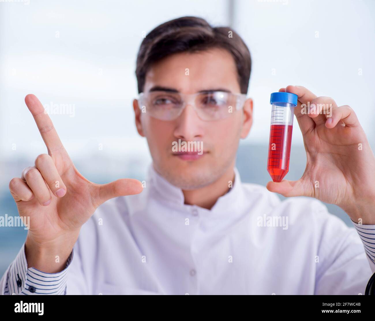 The man doctor checking blood samples in lab Stock Photo - Alamy