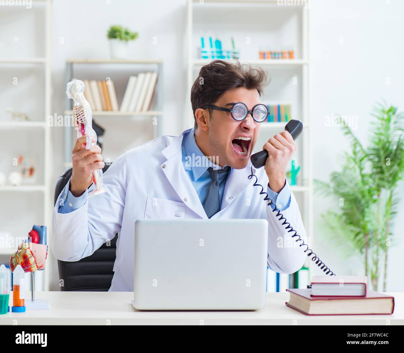The funny doctor having fun in hospital lab Stock Photo - Alamy
