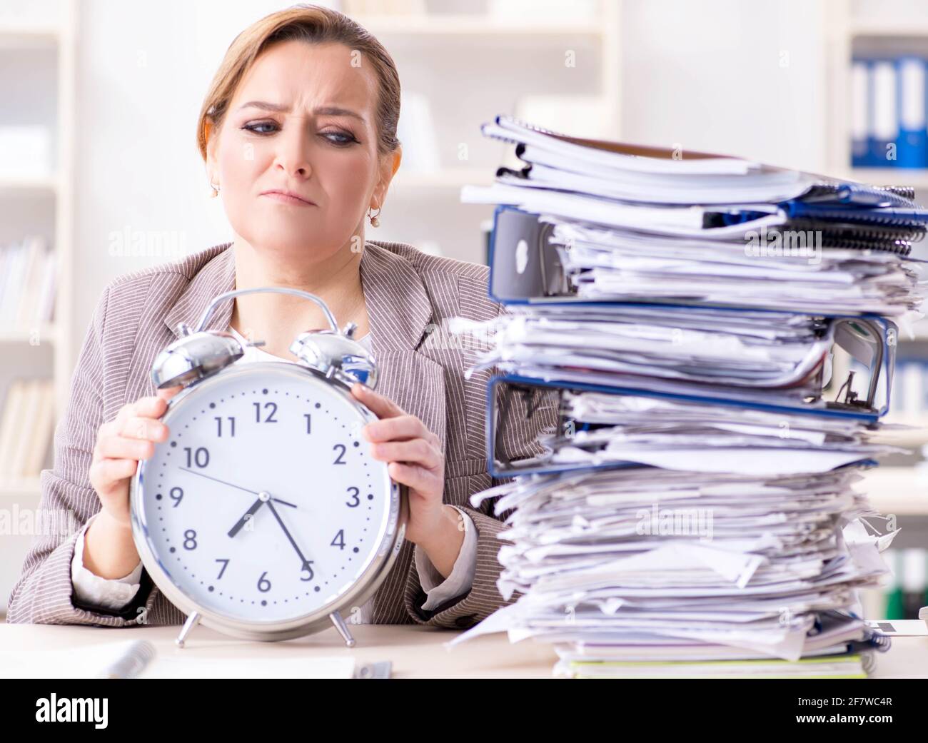 The businesswoman workaholic trying to finish urgent paperwork Stock ...