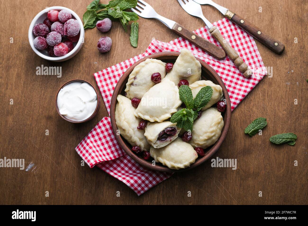 Pierogi with cherries. Vareniki dumplings. Traditional Ukrainian food ...