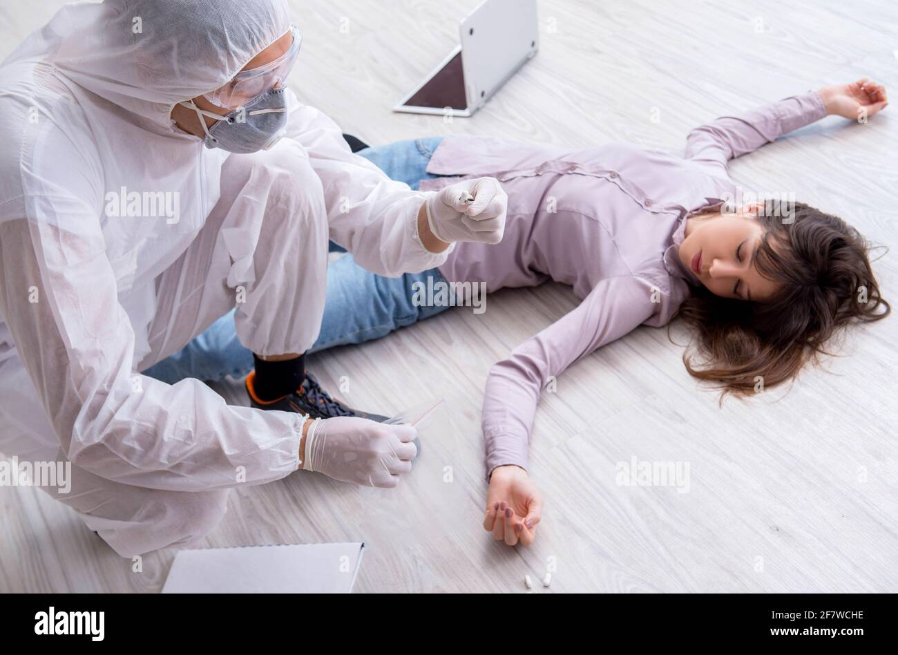 Forensic investigator at the crime scene investigating woman murder ...