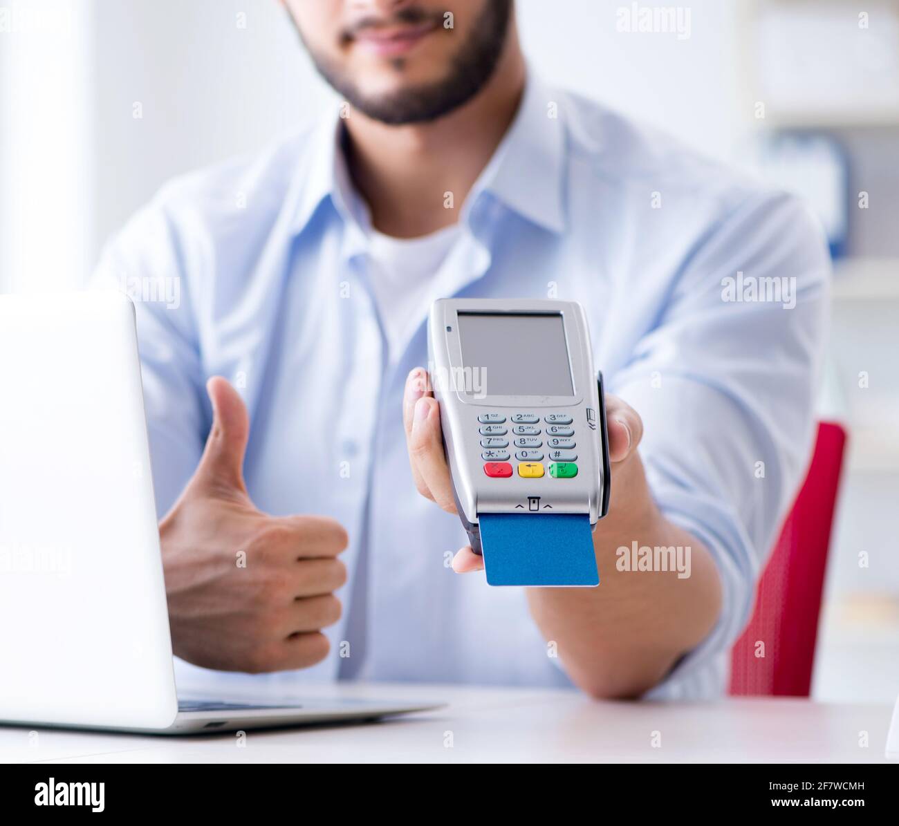 The man processing credit card transaction with pos terminal Stock ...