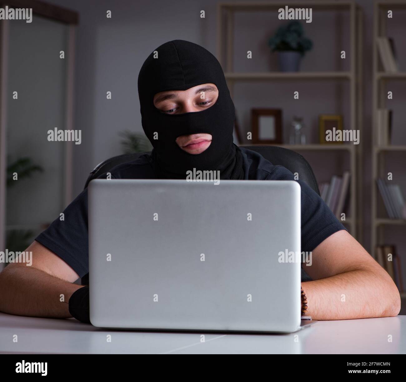 The hacker hacking computer late at night Stock Photo - Alamy
