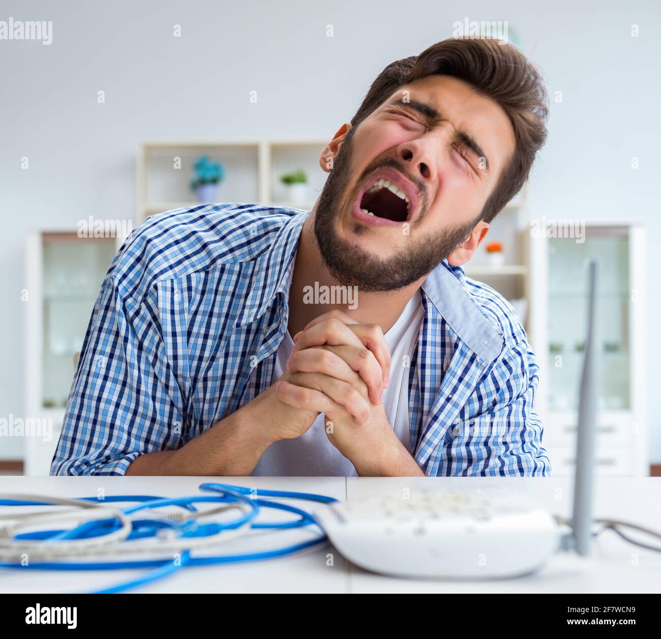 The frustrated young man due to weak internet reception Stock Photo - Alamy