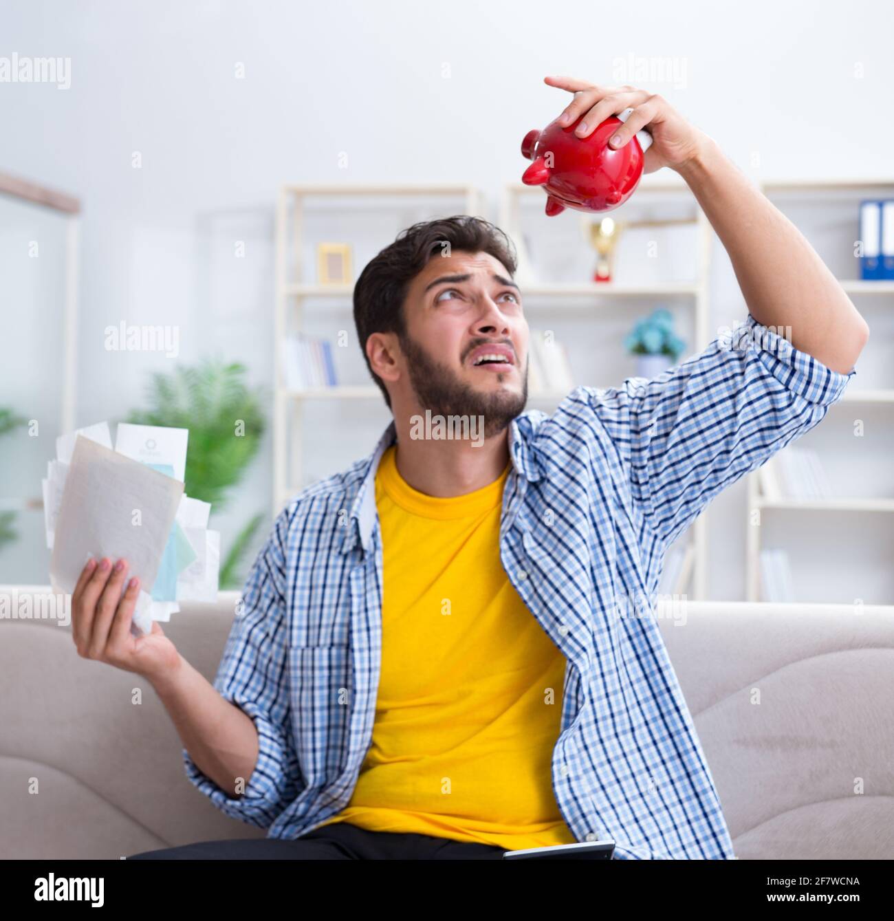 The man angry at bills he needs to pay Stock Photo - Alamy