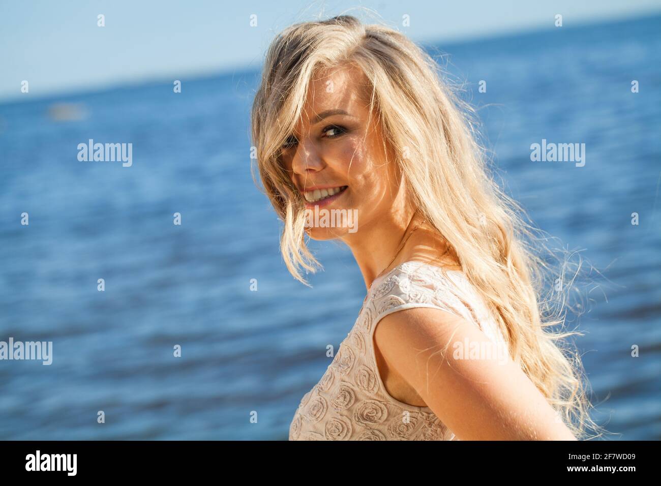 Beautiful blonde woman in sun light outdoor Stock Photo - Alamy