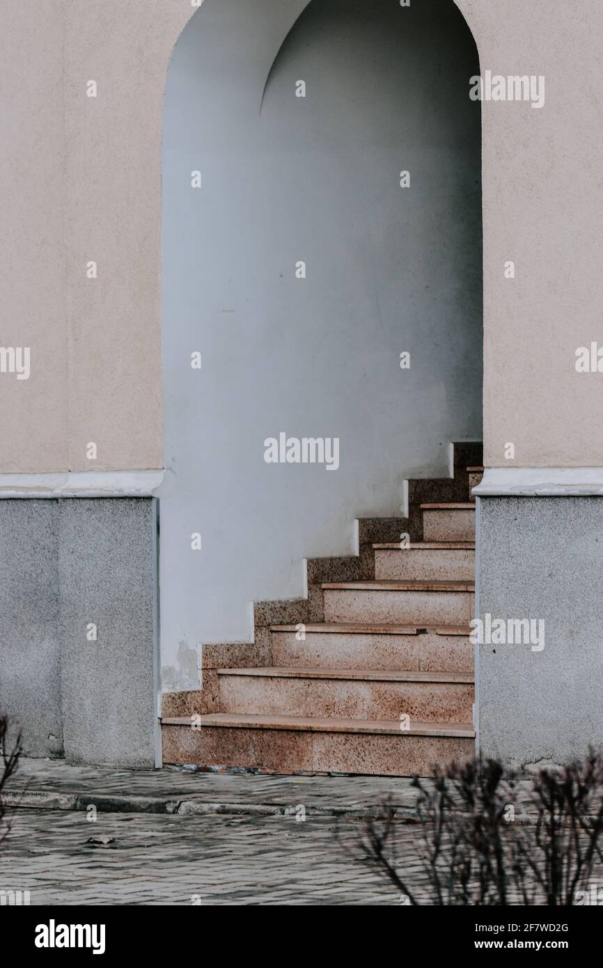 Vertical shot of an arched entrance of a building with stairs Stock ...