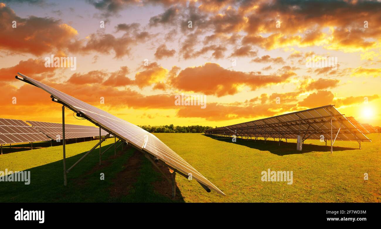 Solar panels at sunset. Power plant using renewable energy. Sustainable ...