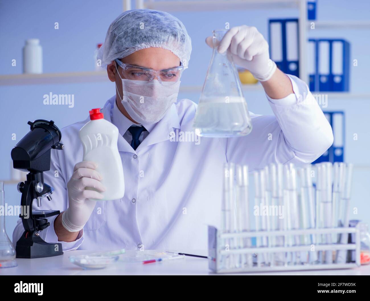 The man in the lab testing new cleaning solution detergent Stock Photo ...