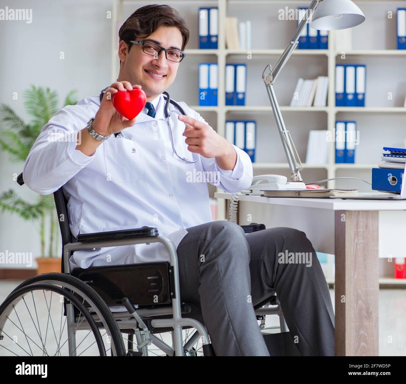 The disabled doctor on wheelchair working in hospital Stock Photo - Alamy