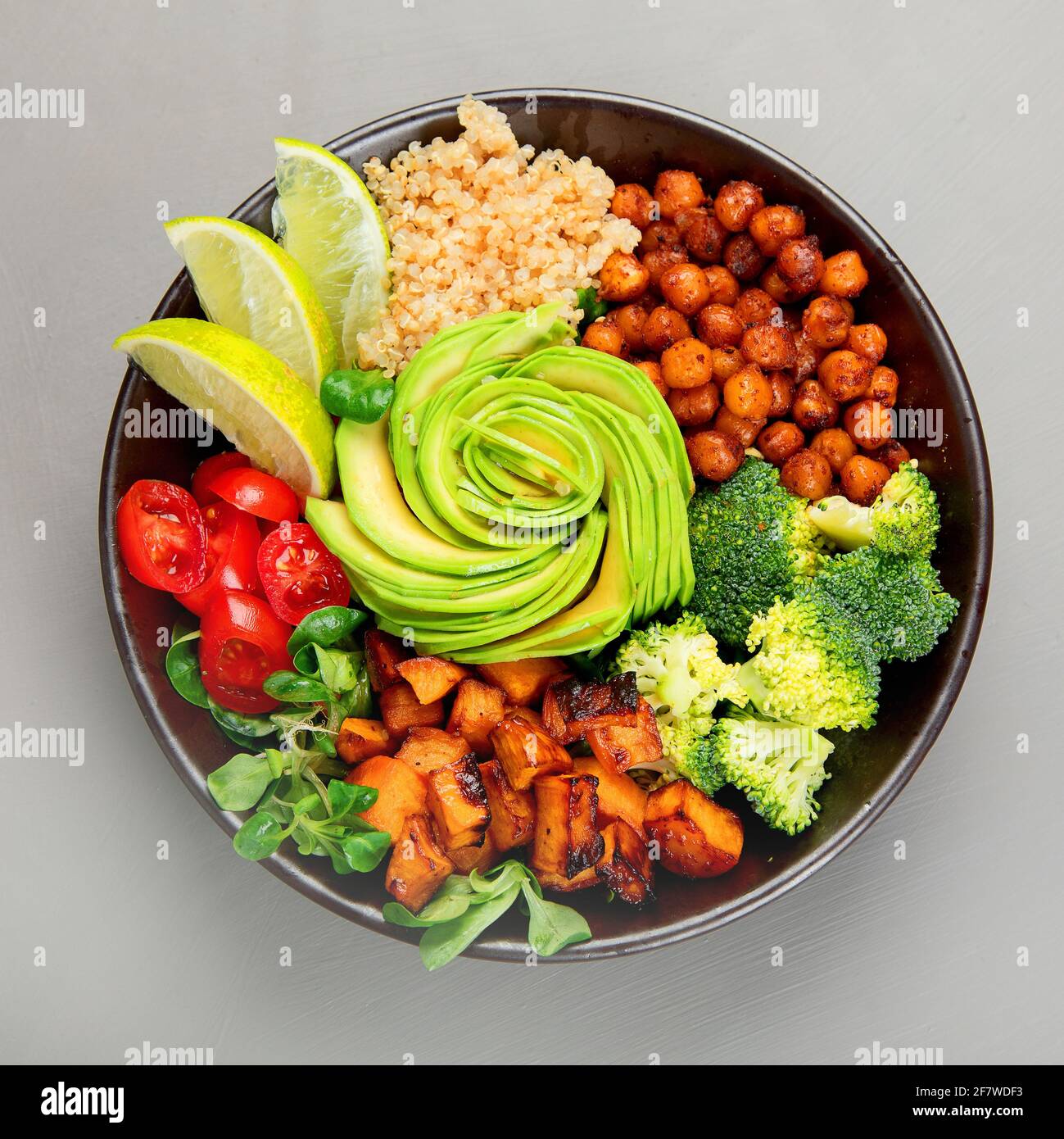 Buddha bowl of mixed grilled vegetables on light background. Healthy eating concept. Top view ...