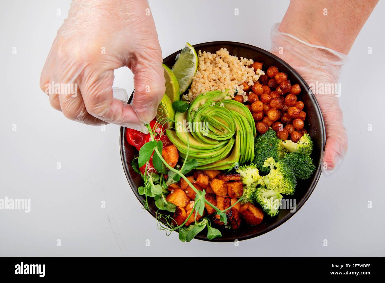 Buddha bowl of mixed grilled vegetables on light background. Healthy eating concept. Top view ...